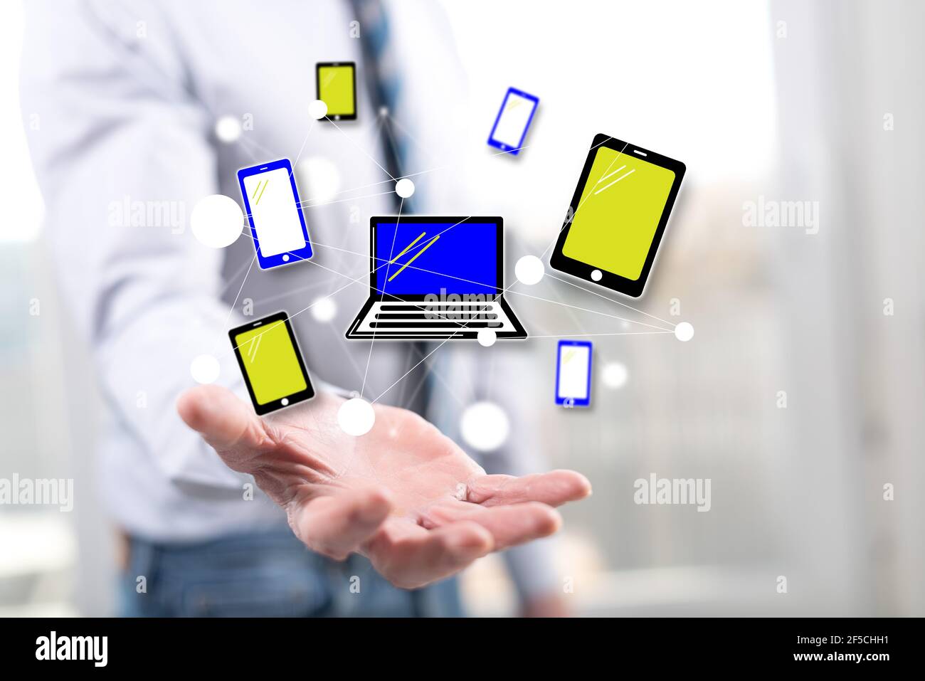 Devices connection concept above the hand of a man in background Stock ...