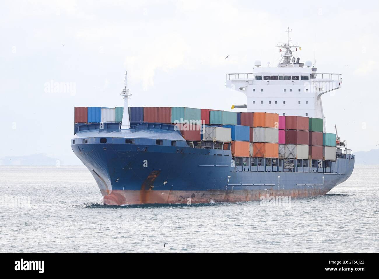 A container ship carrying goods between ports Stock Photo - Alamy