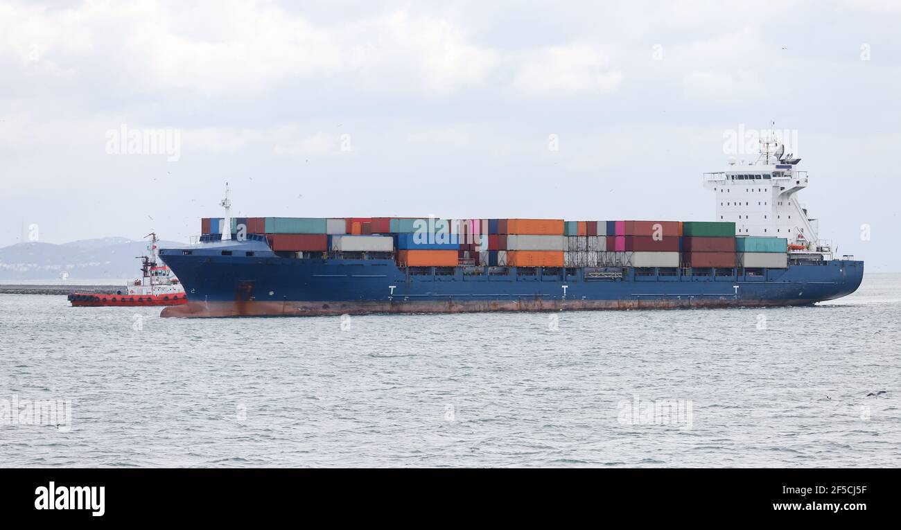 A container ship carrying goods between ports Stock Photo - Alamy