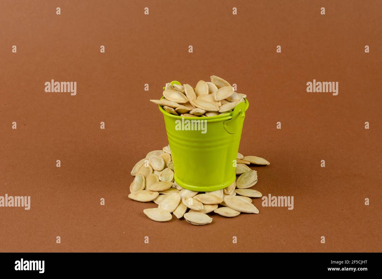 Small bucket pumpkin seeds hi-res stock photography and images - Alamy