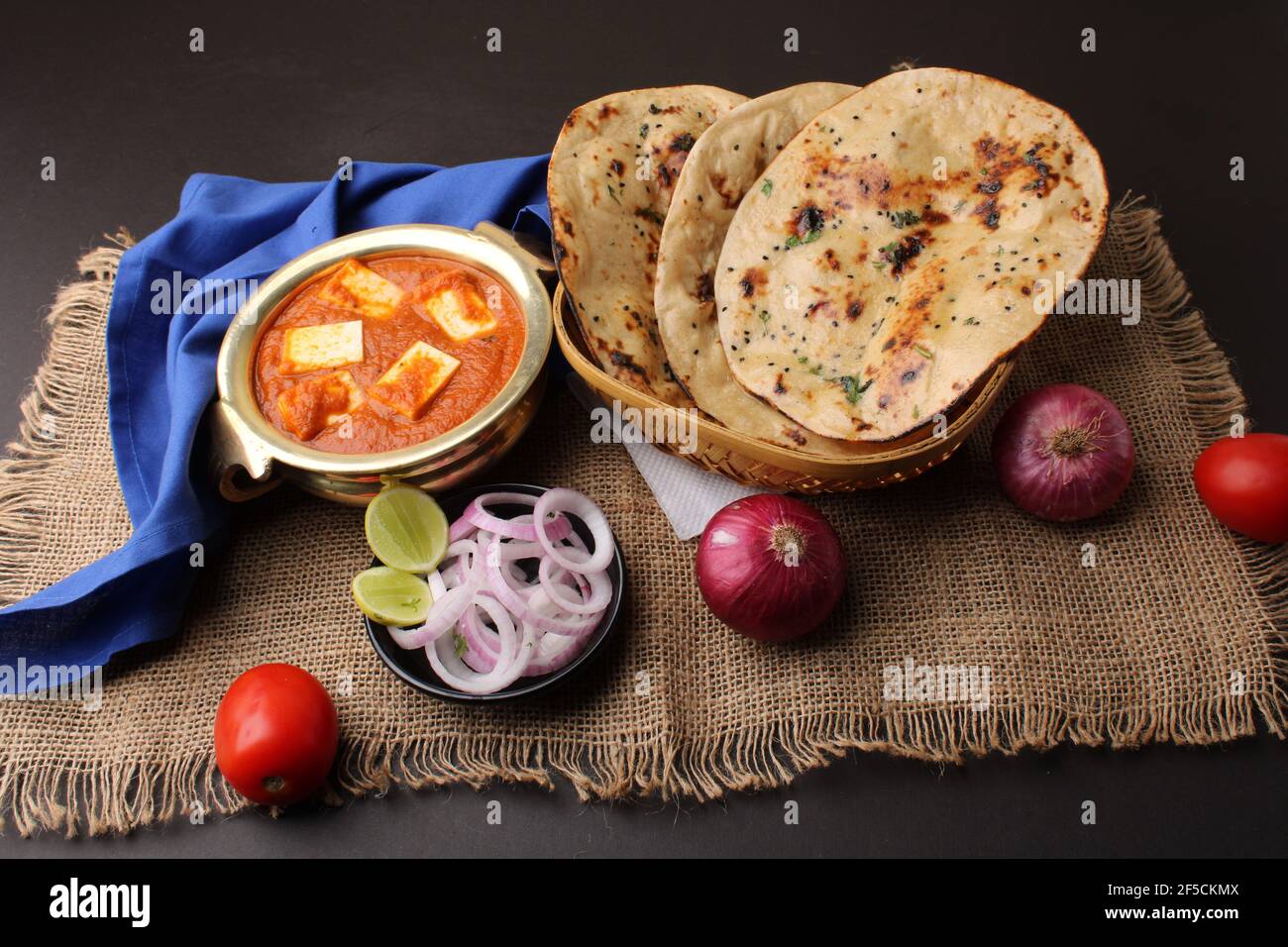 Paneer Butter Masala or Cheese Cottage Curry in serving a bowl or pan ...