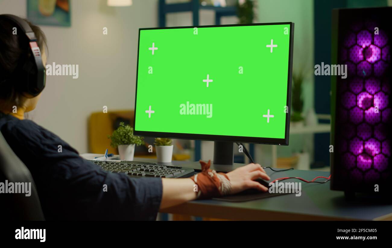 Woman gamer streaming online video games on powerful computer with ...