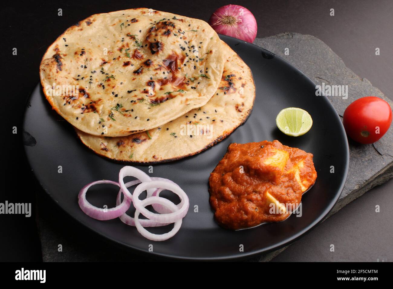 Paneer Butter Masala or Cheese Cottage Curry served with naan or ...