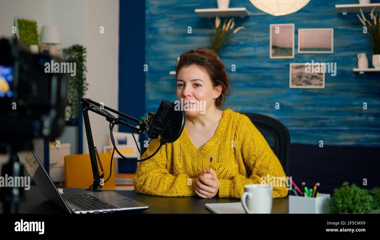 Influencer doing vlog production with professional gear in home studio ...