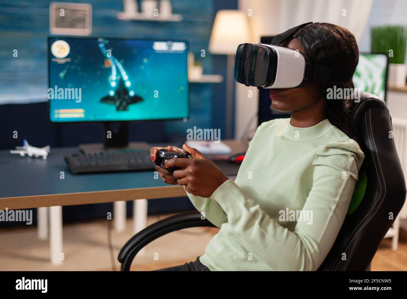 African streamer gamer experiencing virtual reality wearing headset ...