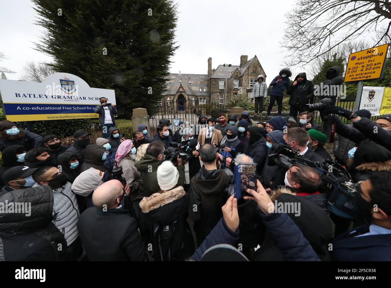 Protesters give a statement to members of the media outside Batley ...