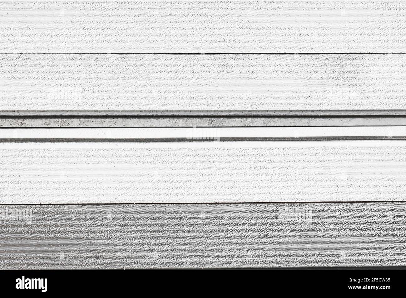 An element or part of the light white wooden facade of the house ...