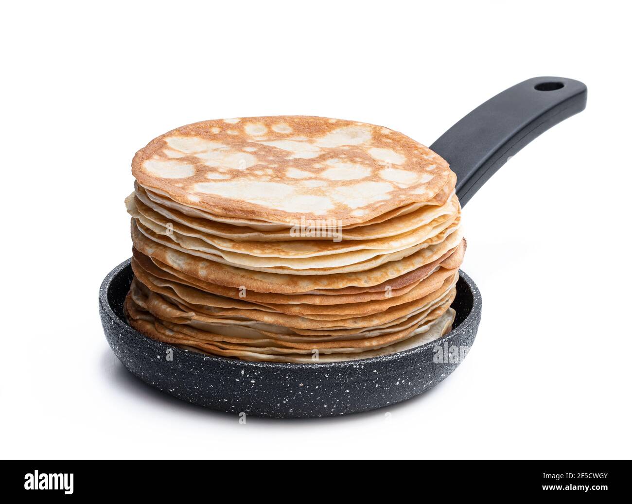 Stack of thin pancakes in small frying pan isolated on white Stock ...