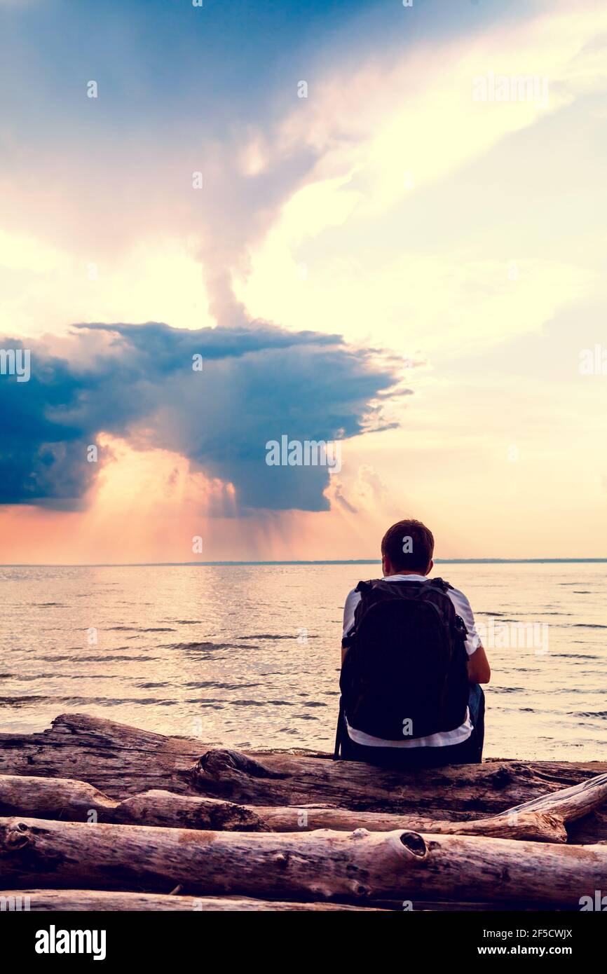 Toned Photo of Lonely Man sit on the Bench at Sunset Background Stock ...
