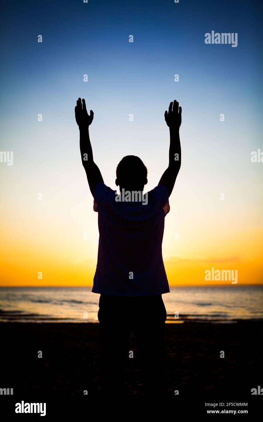 Man rise up hands hi-res stock photography and images - Alamy