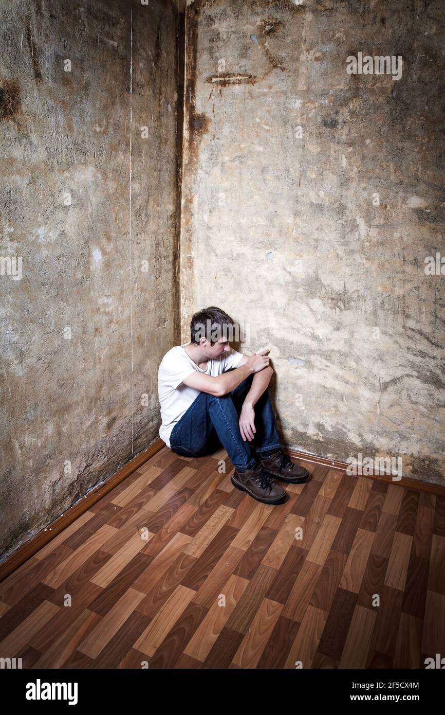 Man in corner of room hi-res stock photography and images - Alamy