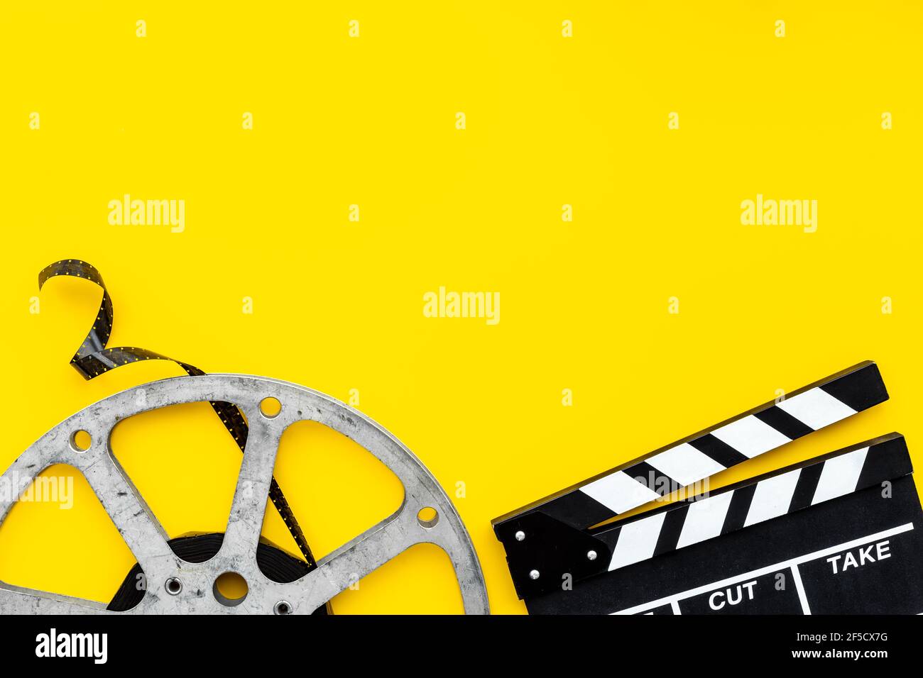 Motion picture film reel with movie clapper. Cinema concept Stock Photo ...