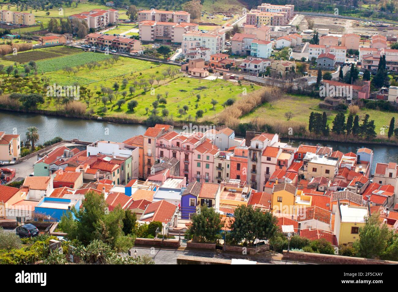 cityscape of the beautiful village of Bosa with colored houses and a ...