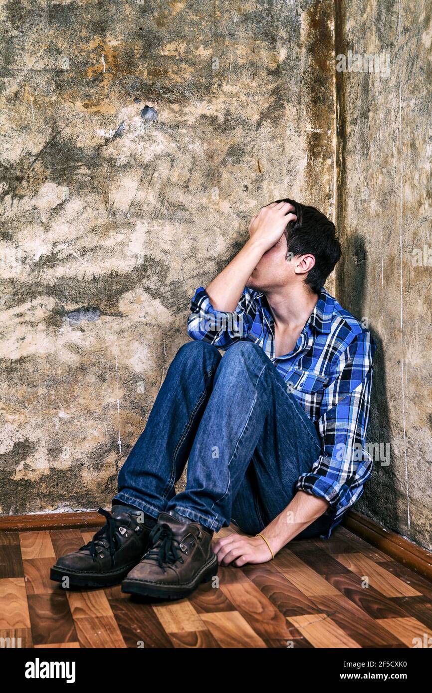 Man in corner of room hi-res stock photography and images - Alamy