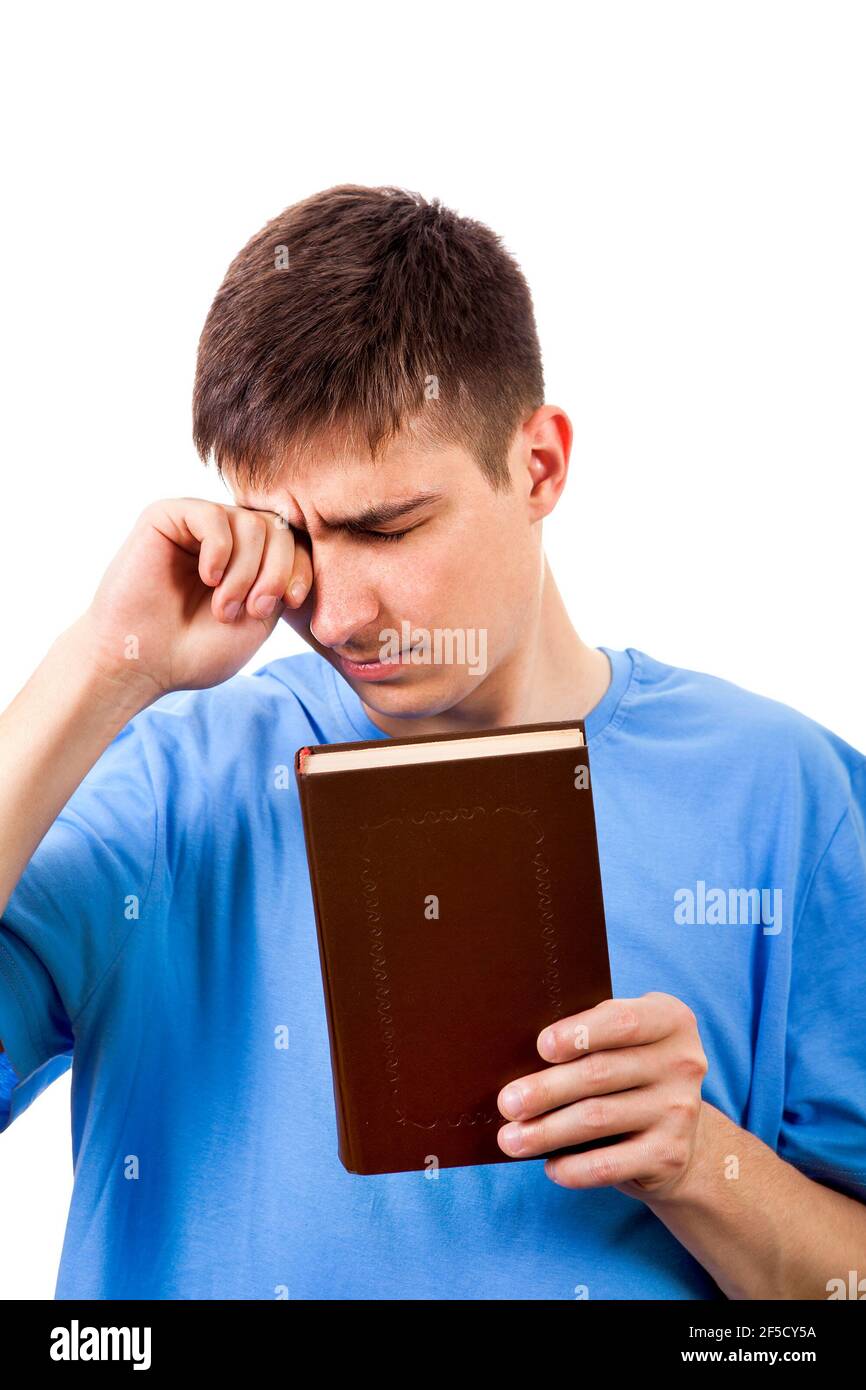 Tired Young Man with a Book Isolated on the White Background Stock ...