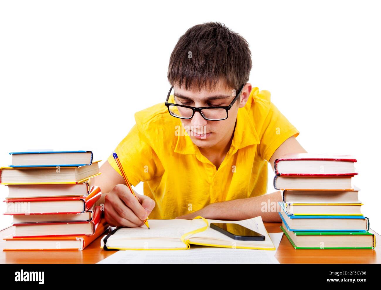 Student writing at the School Desk on the White Background Stock Photo ...