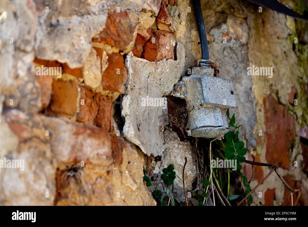 Old electric socket on the outside wall of an old building Stock Photo ...