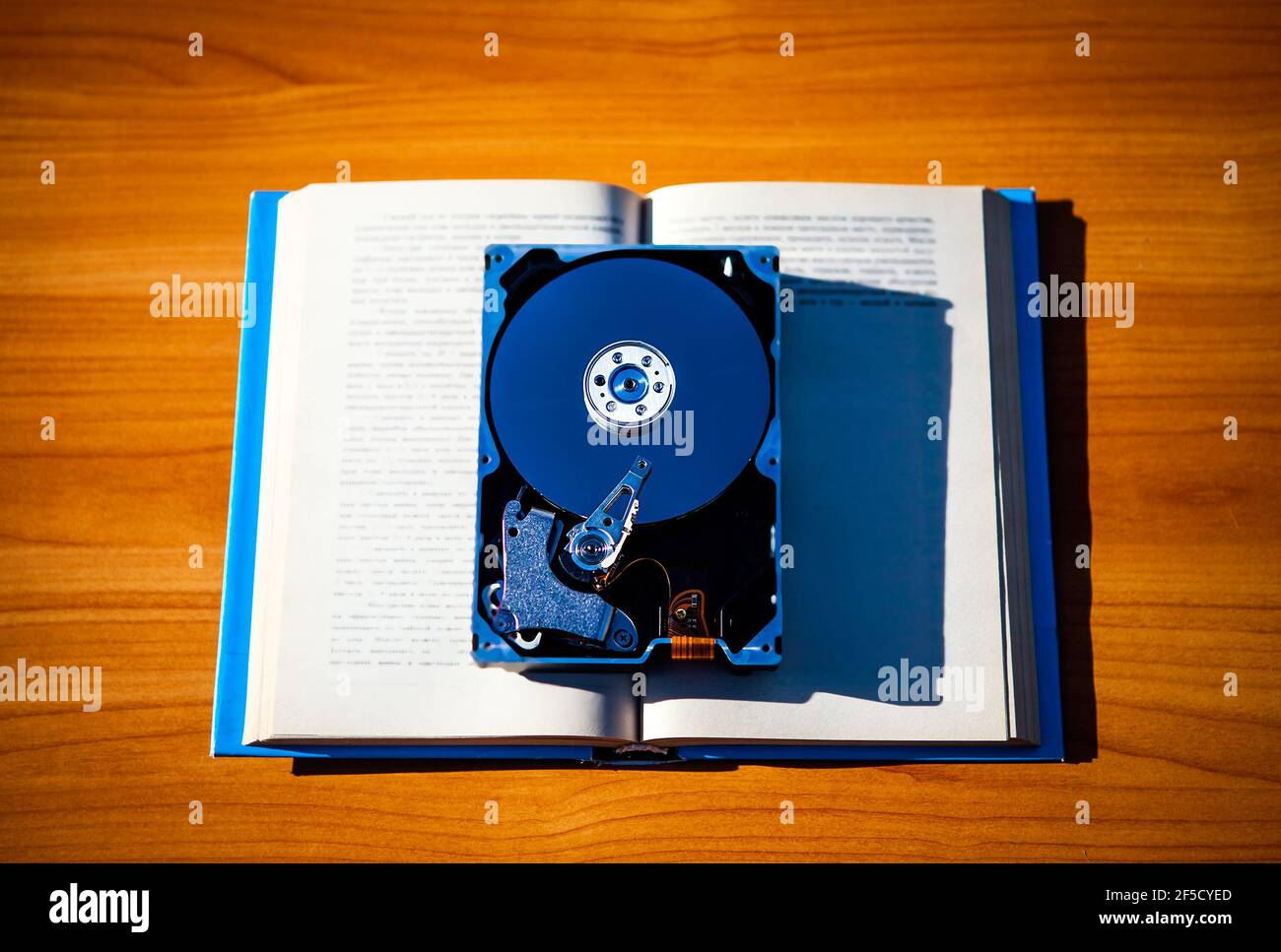 Opened Hard Disk Drive on the Book Stock Photo - Alamy