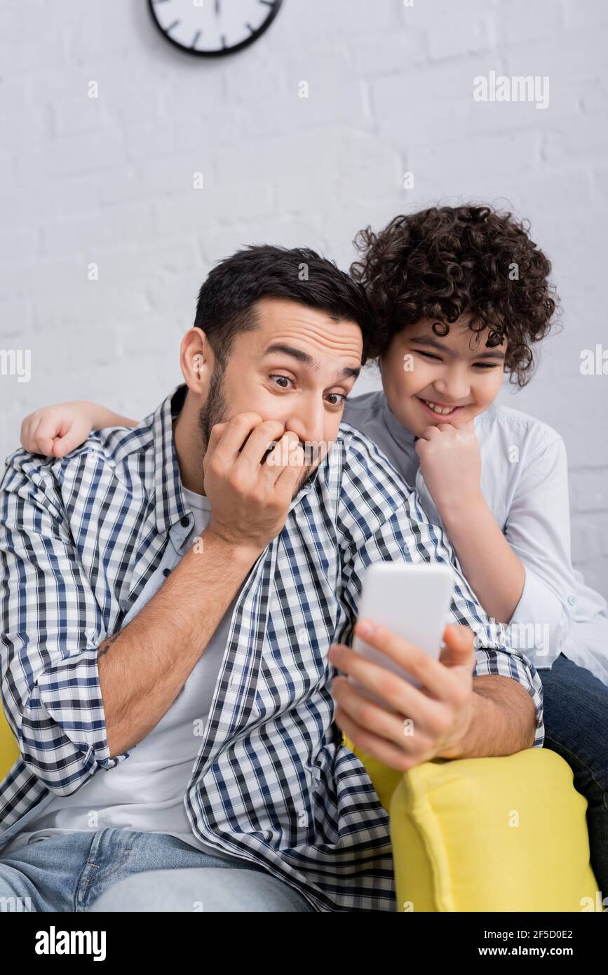 Middle east boy mobile phone hi-res stock photography and images - Alamy
