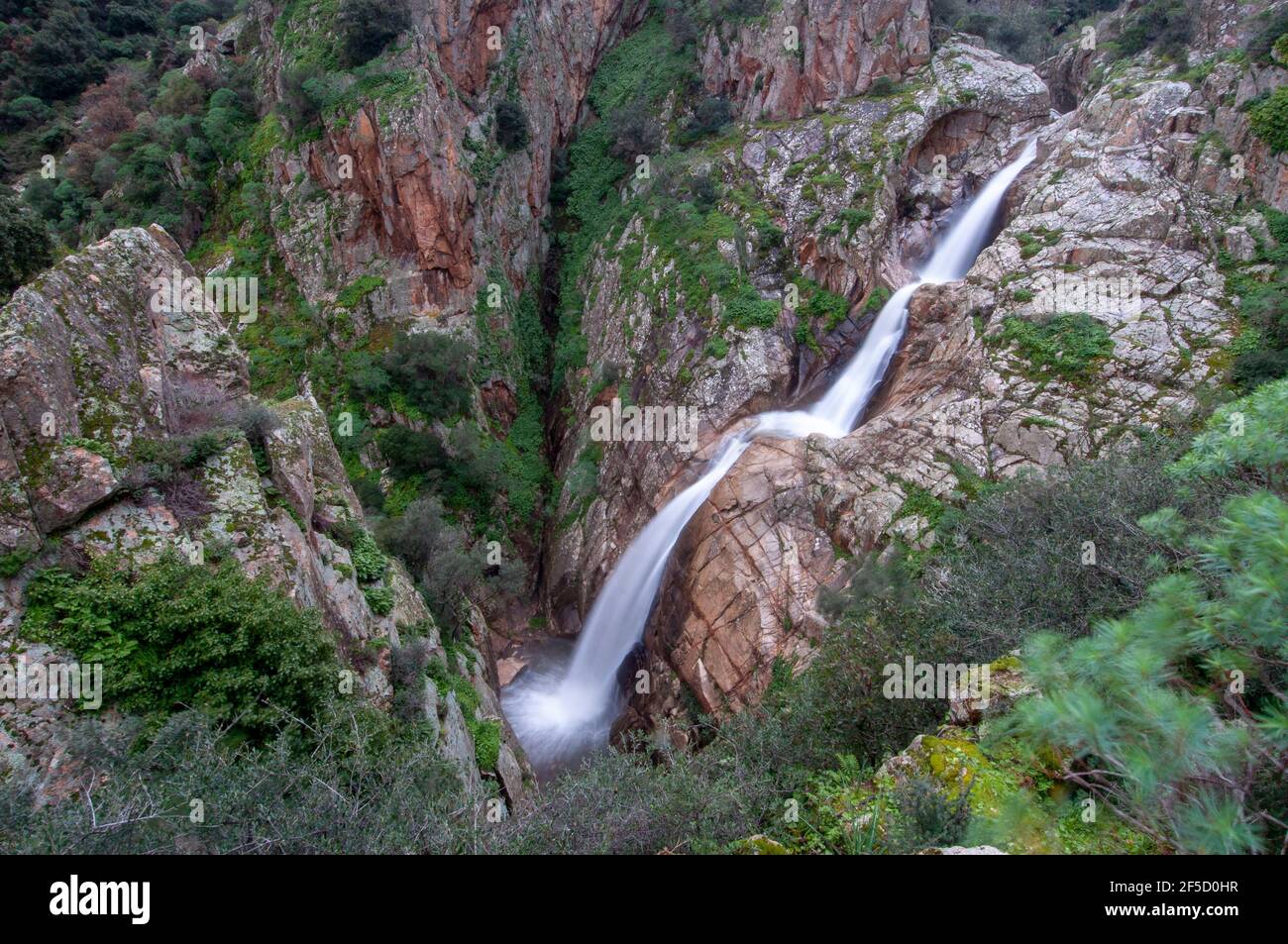 waterfall of sa spendula and water flows through the rocks, Villacidro ...
