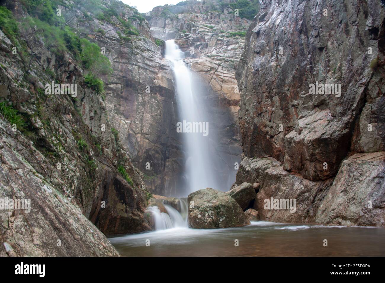 waterfall of sa spendula and water flows through the rocks, Villacidro ...