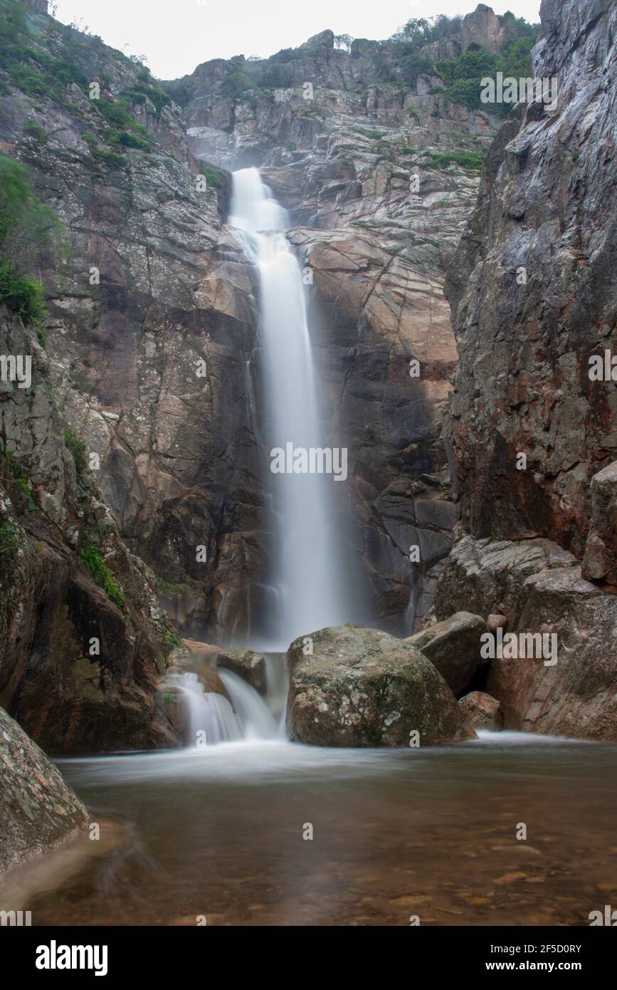 waterfall of sa spendula and water flows through the rocks, Villacidro ...