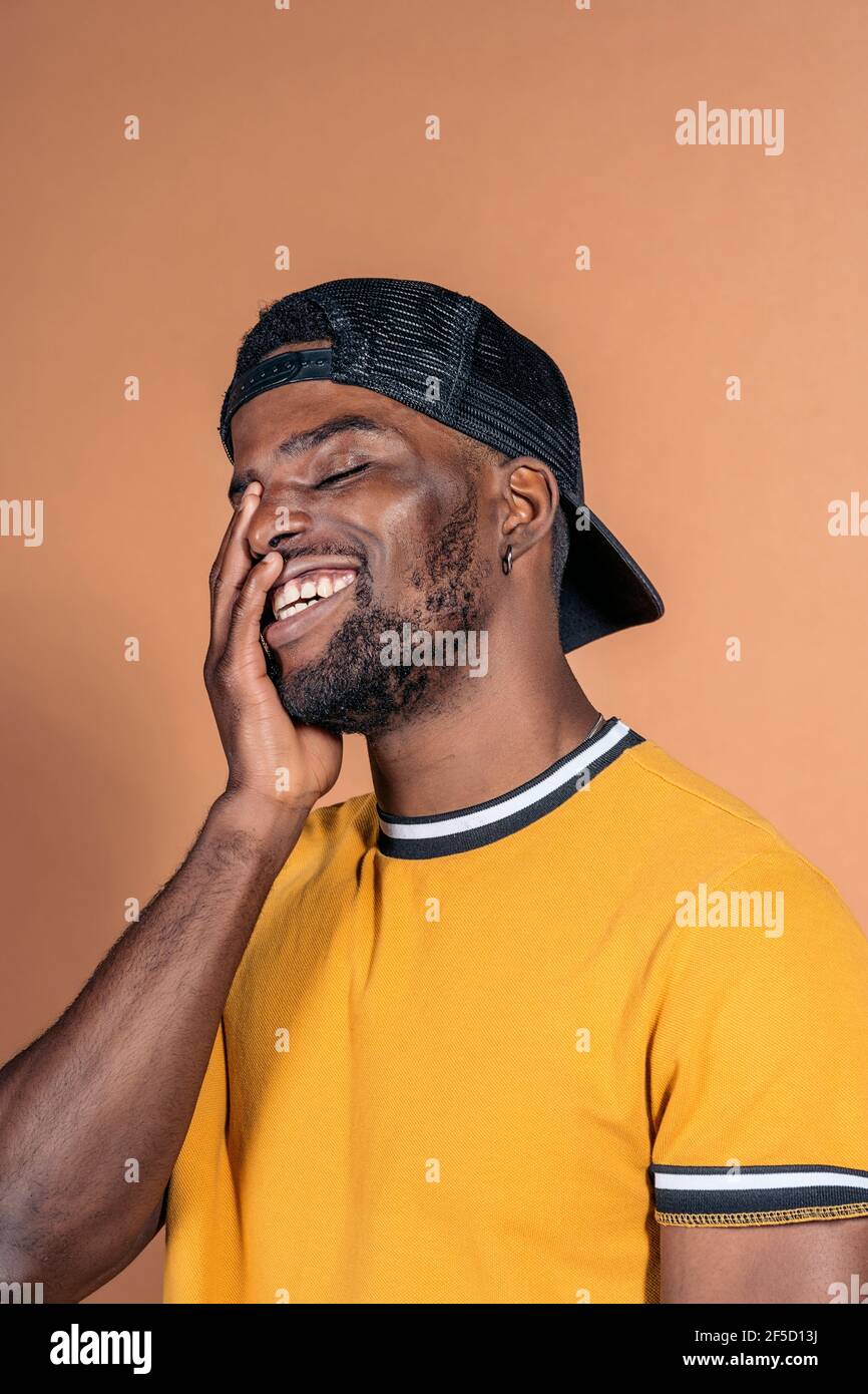 Stock photo of handsome black boy in studio shot laughing and having ...