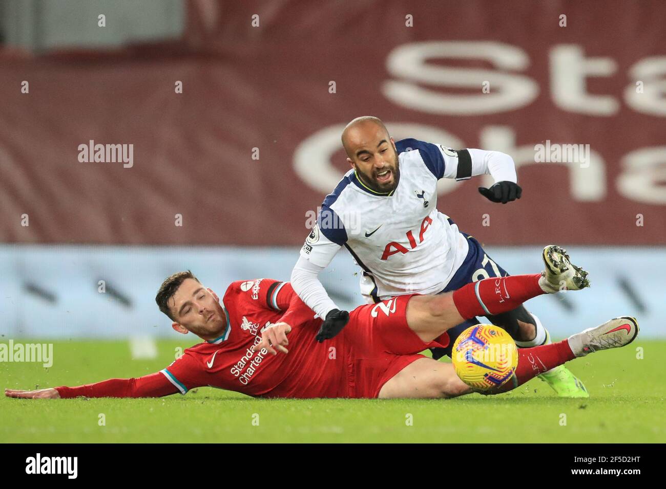 Andrew Robertson #26 of Liverpool slides in to win the ballroom Lucas ...