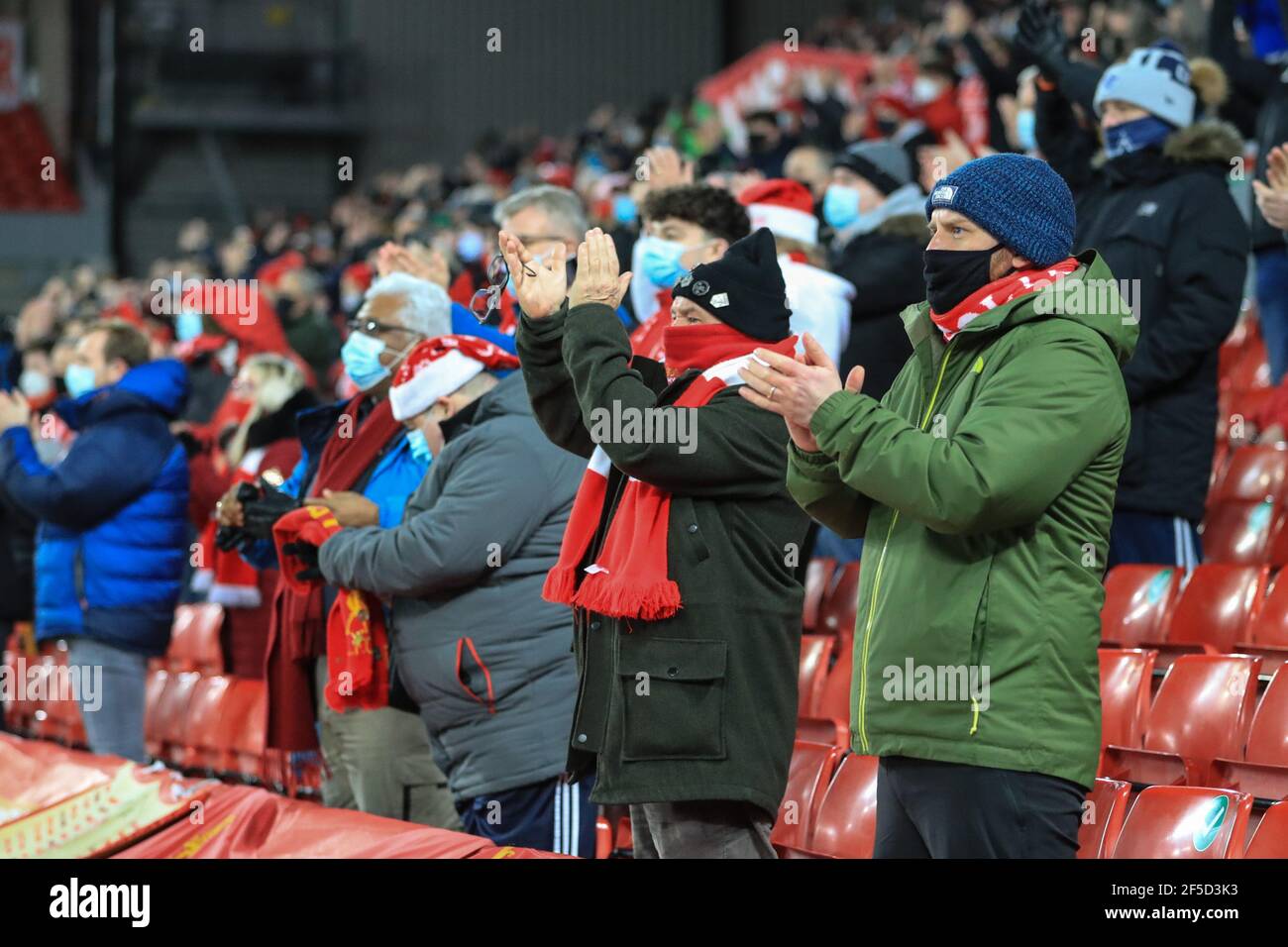 Liverpool fans clap just before kick-off Stock Photo - Alamy