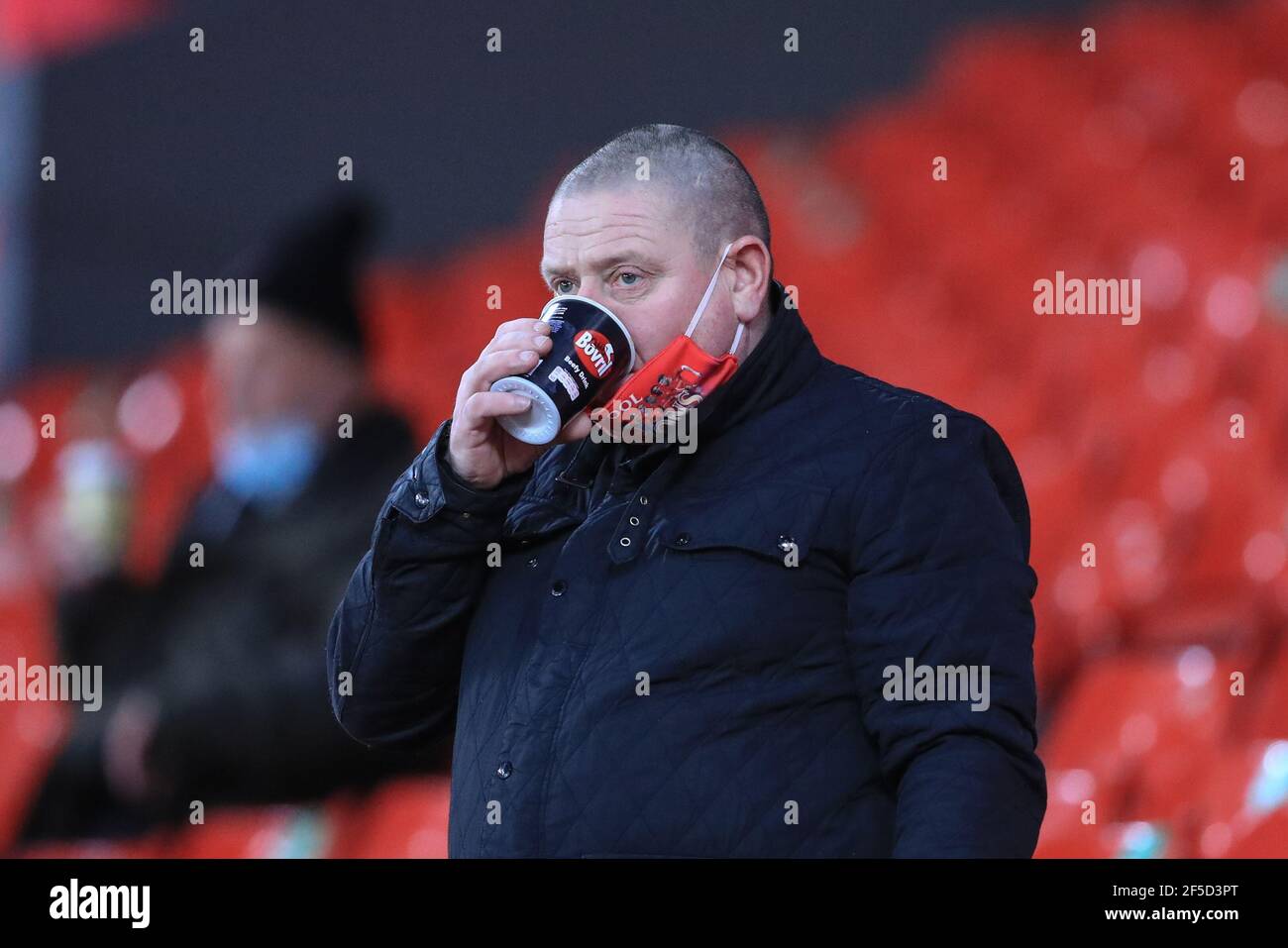A Liverpool fan having a drink as fans return to the Cop at Anfield ...