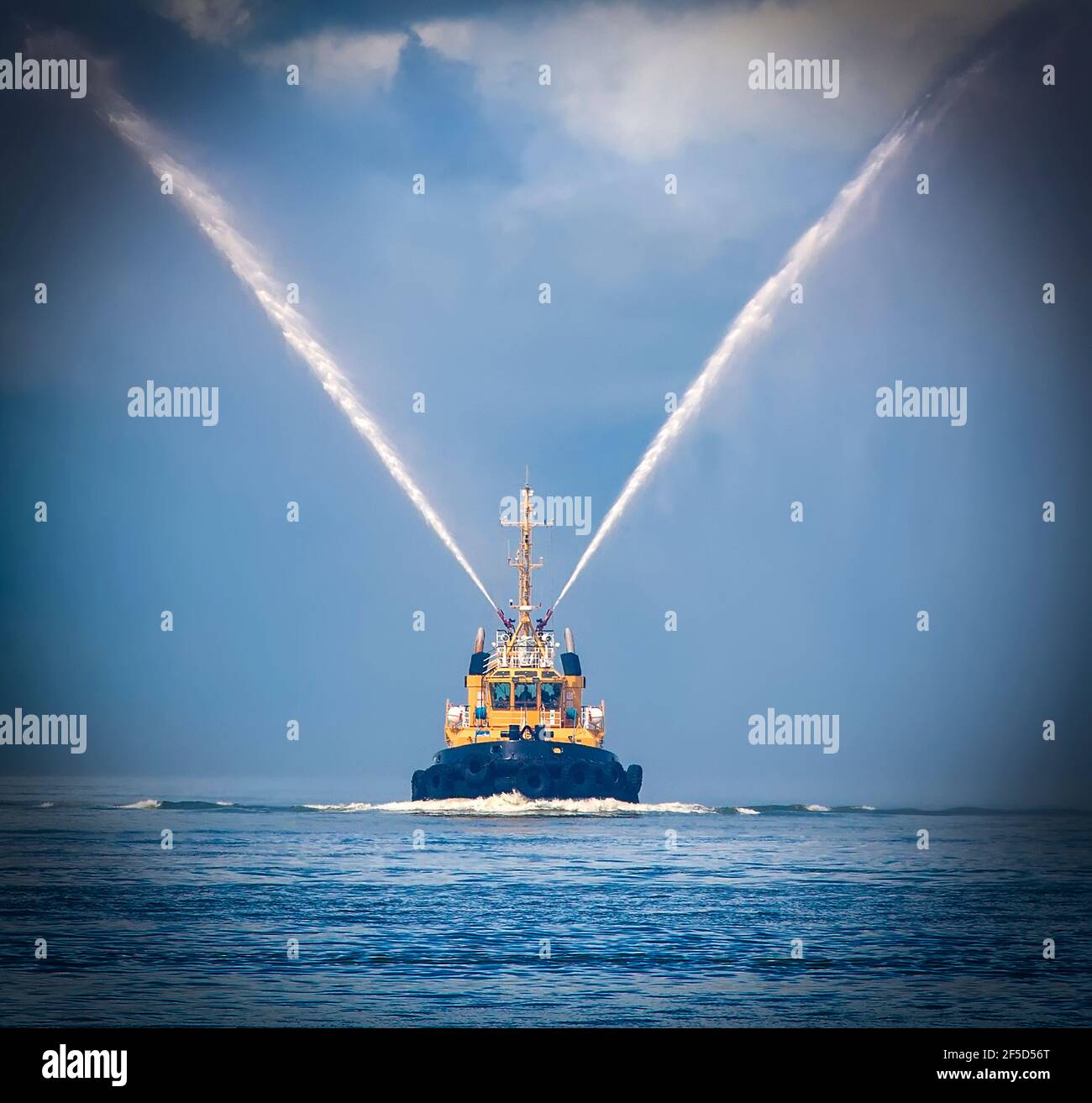 The fire hose boat spraying water on Kamchatka on Paciic ocean Stock ...