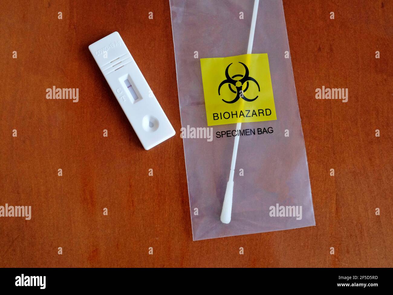 Coronavirus (COVID-19) rapid test with negative result next to a nasal ...