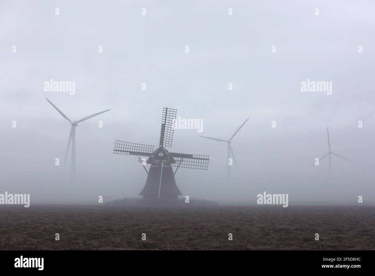 Windmills in mist hi-res stock photography and images - Alamy
