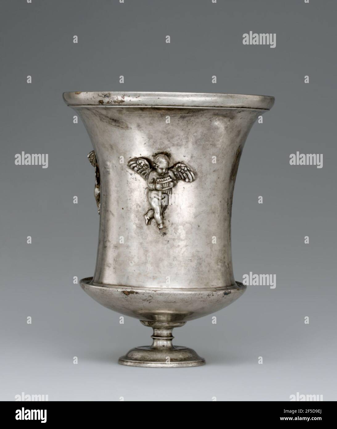 Drinking Cup. The cup has a tall concave body, an offset convex molding ...