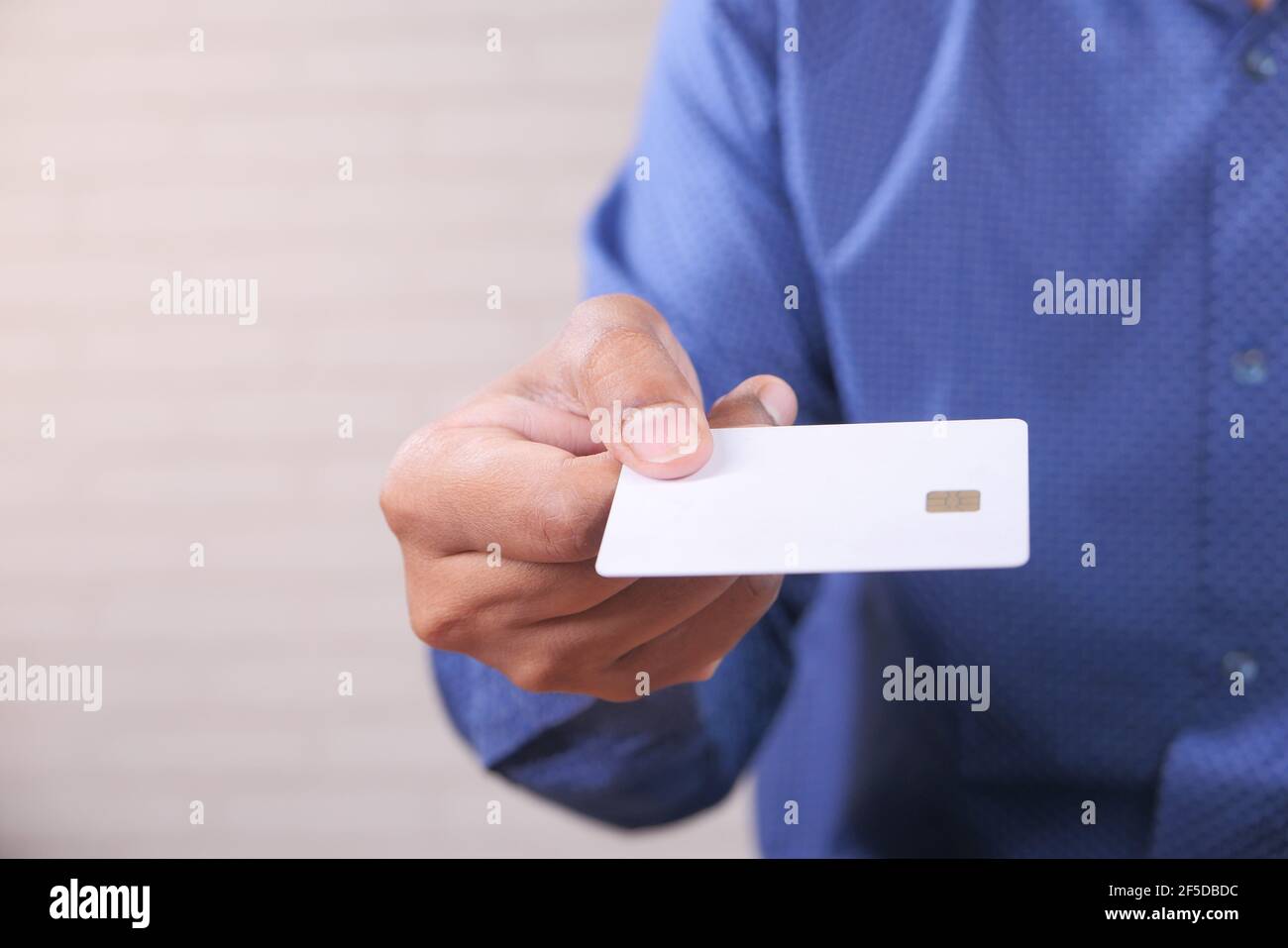 hand holding credit cards reading information Stock Photo - Alamy