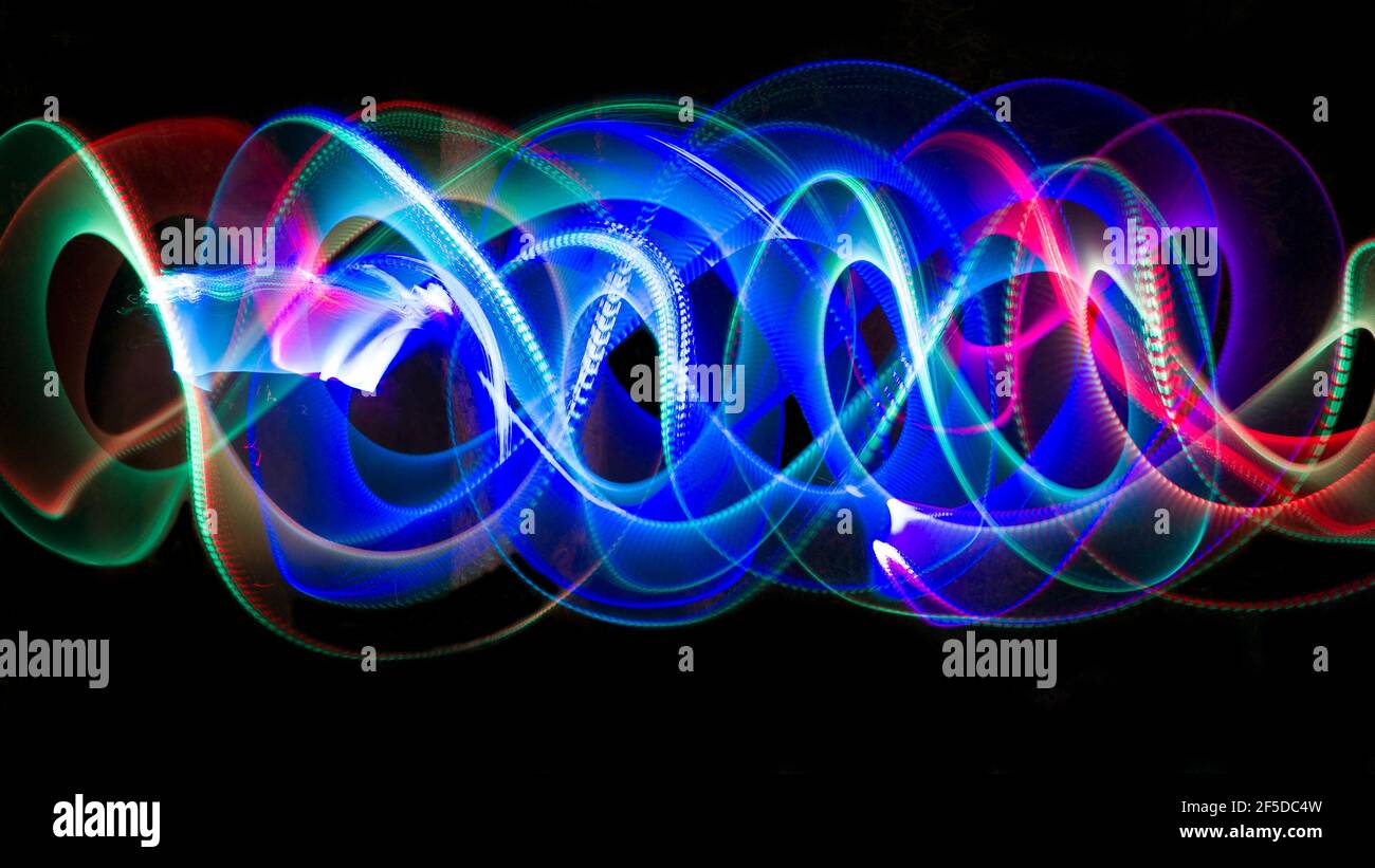 Interwoven strips of light Stock Photo - Alamy