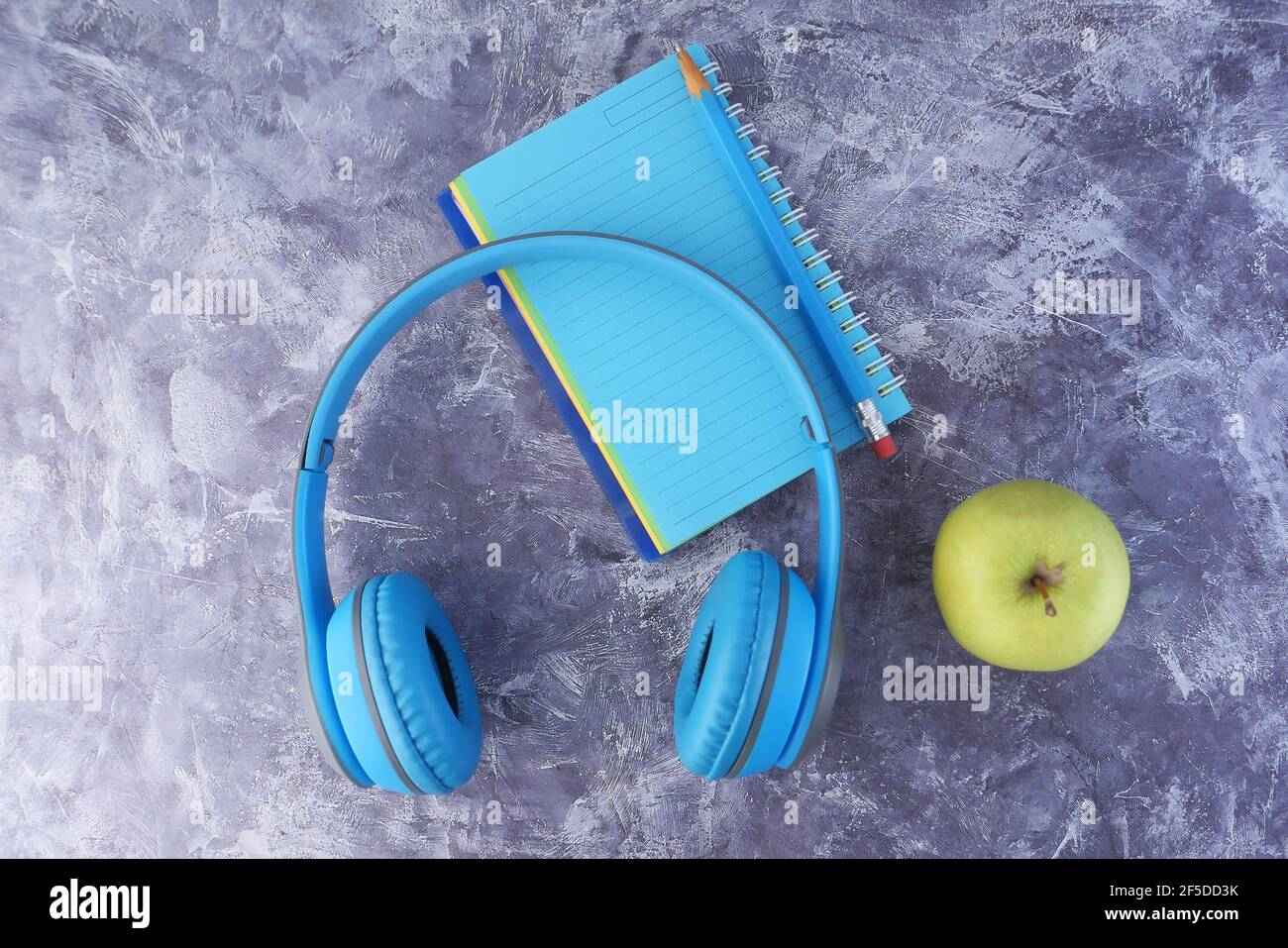 Audio book concept. Headphones and notepad on black background Stock ...