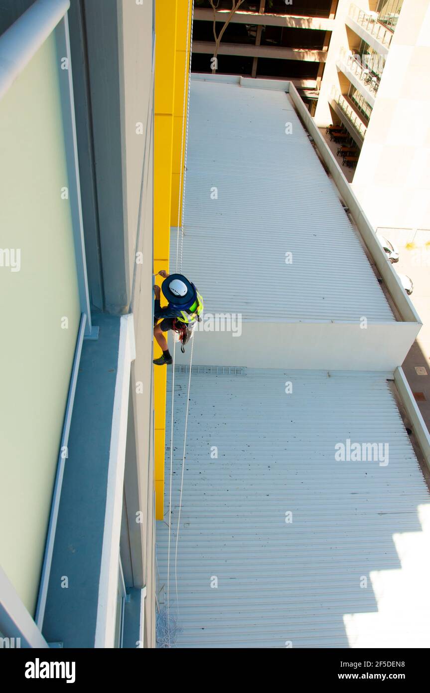 Maintenance Work by an Abseiling Technician Stock Photo - Alamy