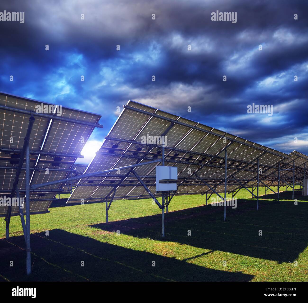 Solar panels with dark cloudy sky. Power plant using renewable energy ...