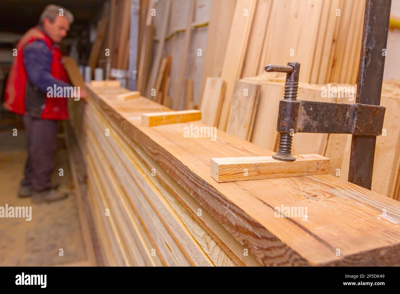 Process of drying glue in the manual production of wooden profiles in ...
