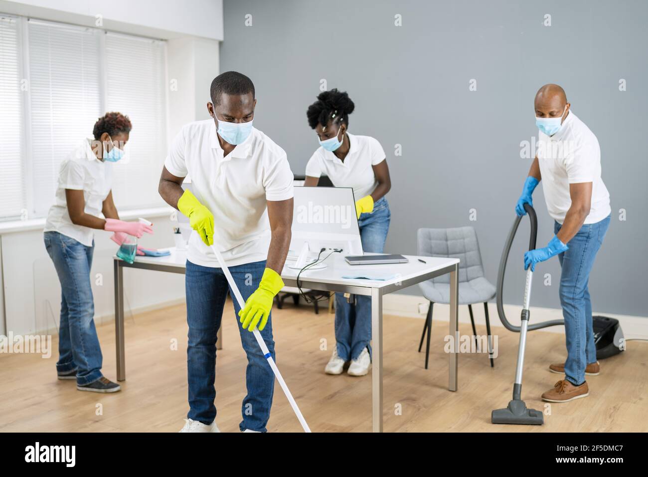 Cleaning Service African Janitor In Face Mask Stock Photo - Alamy