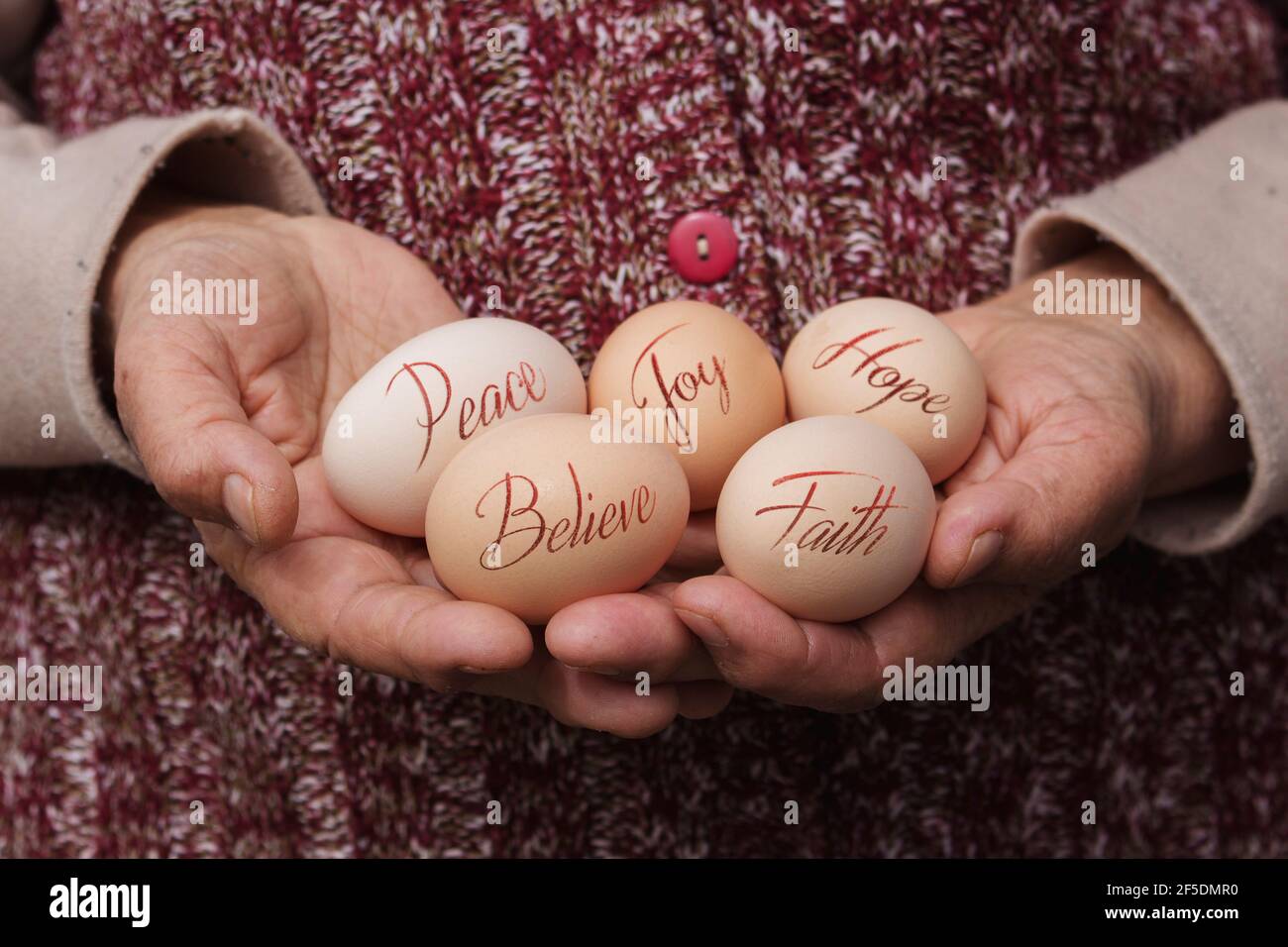 Happy Easter. Grandmother holding Eggs in hands Stock Photo - Alamy
