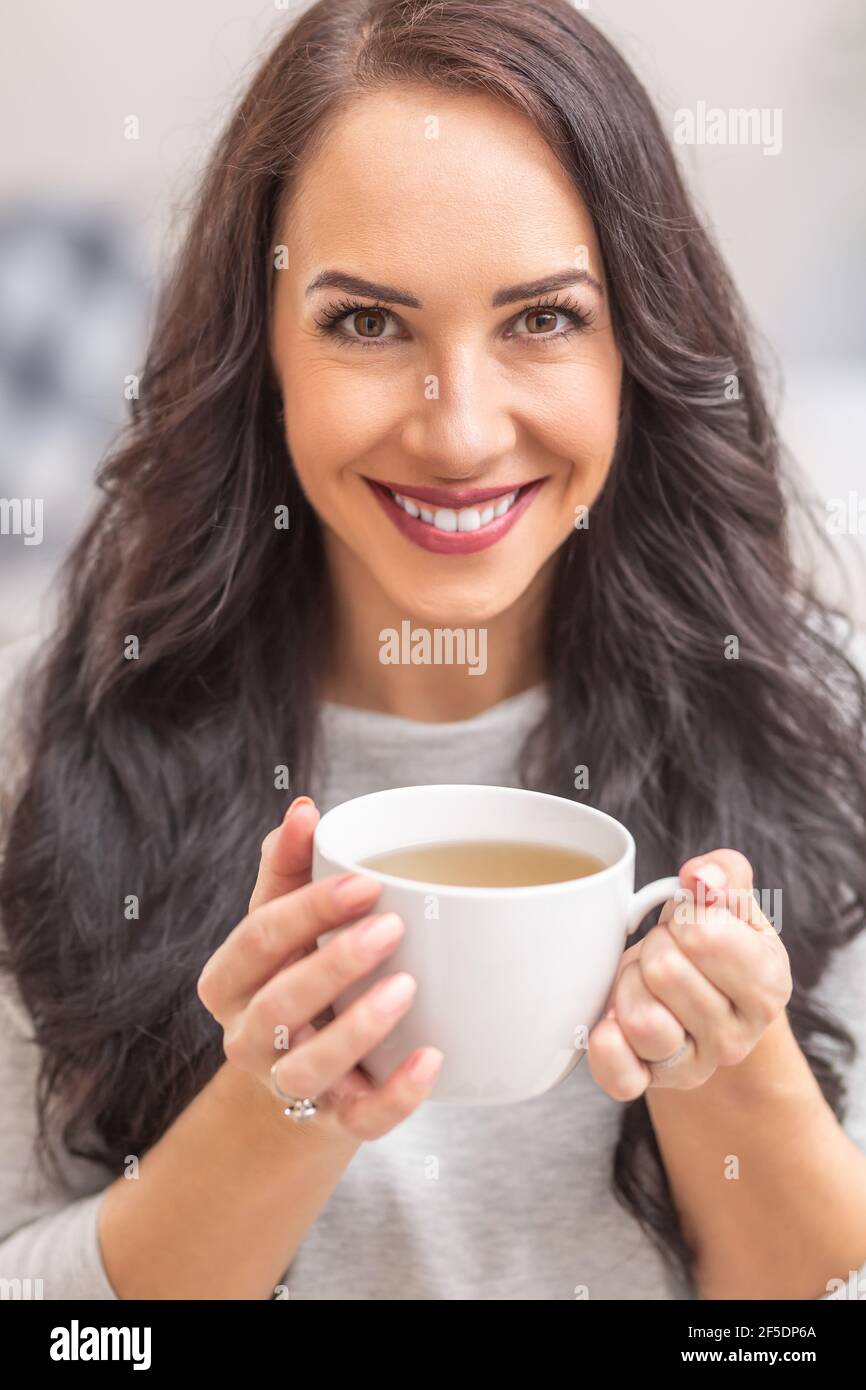 Young woman smelling tea hi-res stock photography and images - Alamy