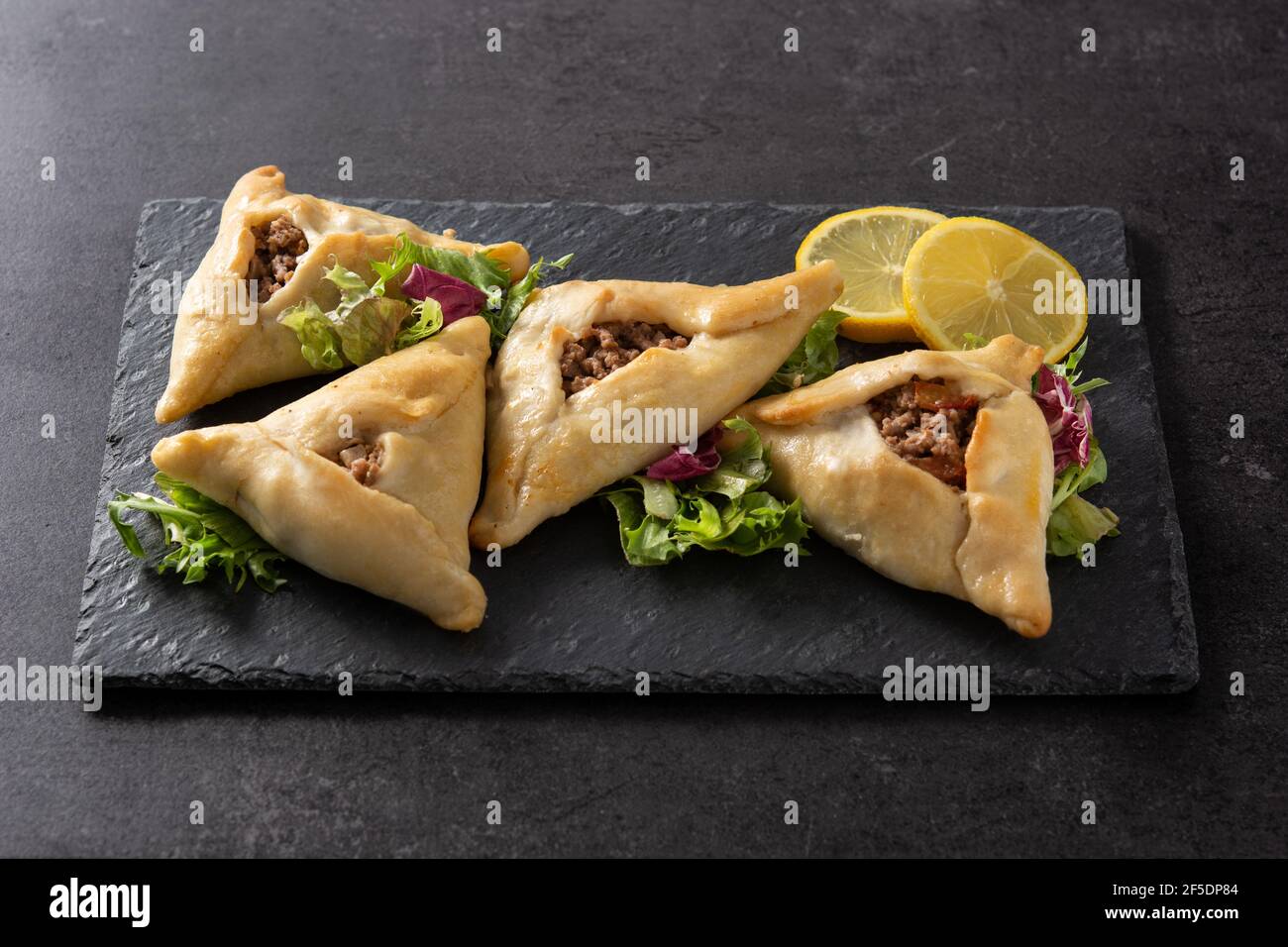 Traditional middle eastern fatayer on black slate background Stock ...