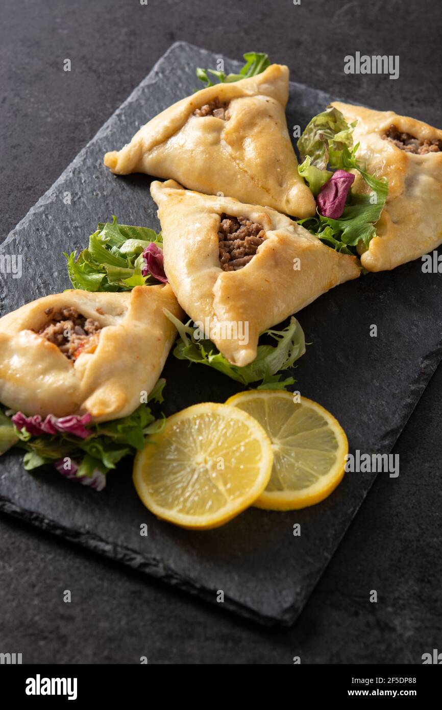 Traditional middle eastern fatayer on black slate background Stock ...