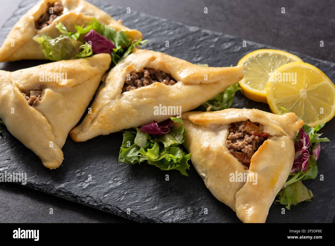 Traditional middle eastern fatayer on black slate background Stock ...