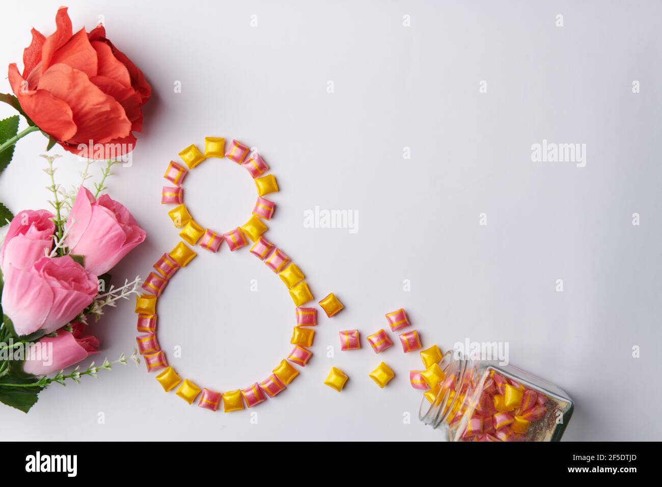 one rose a jar with sweets scattered and a bouquet of roses number ...