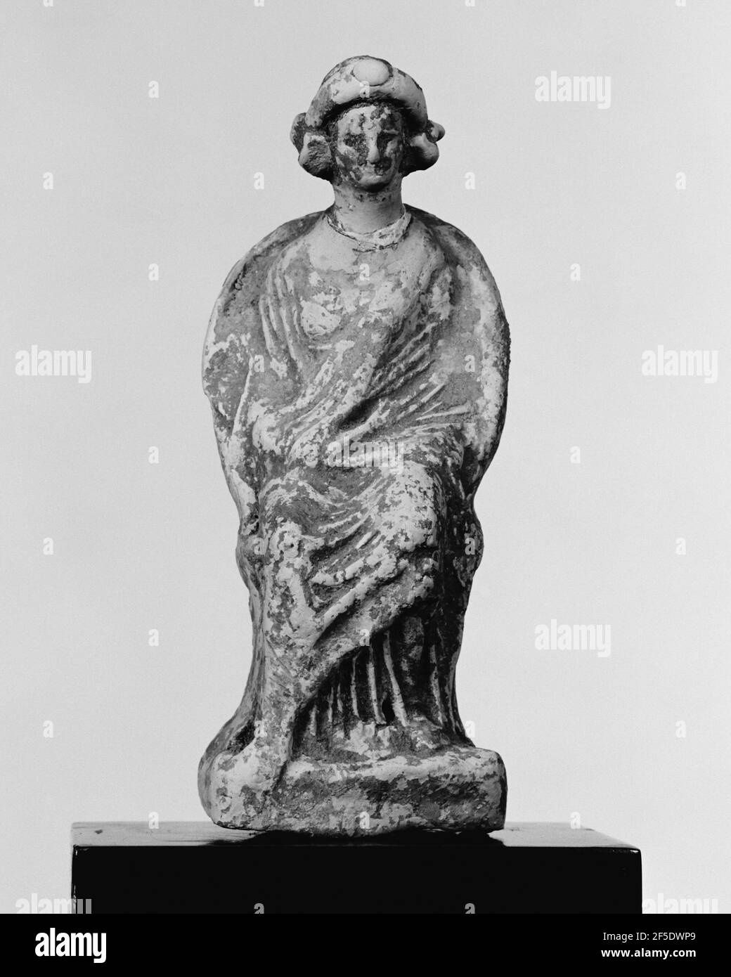 Statuette of a Seated Female Figure. Unknown Stock Photo - Alamy