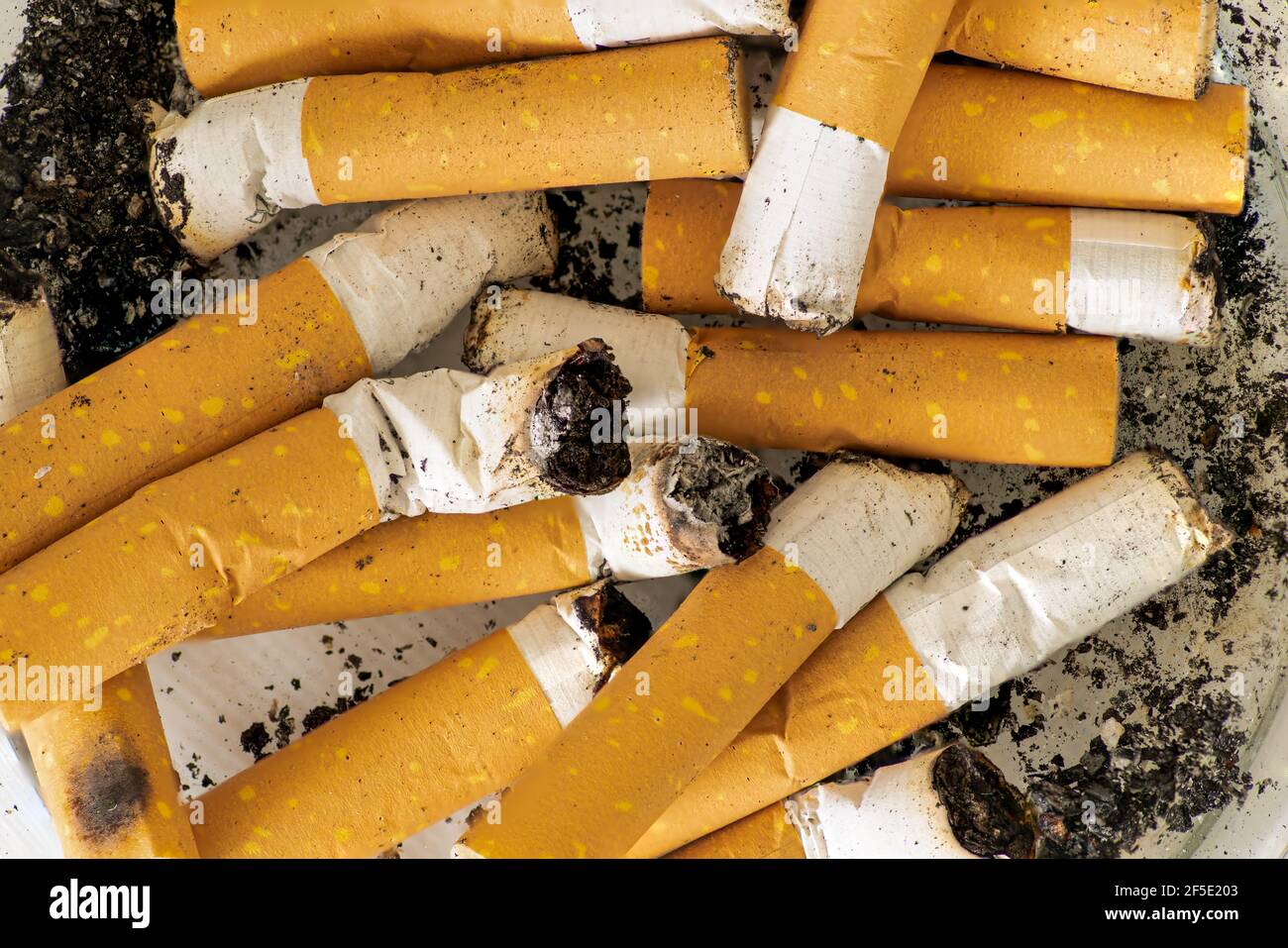 horizontal photo of cigarettes in ashtray Stock Photo - Alamy