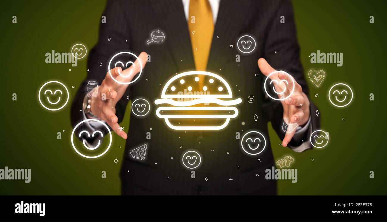 Hand holding food related icons Stock Photo - Alamy